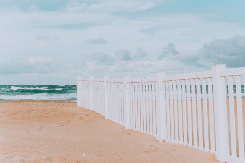 White Fence on a Sandy Beach on a Sunny Summer Day. Horizontal Image ...