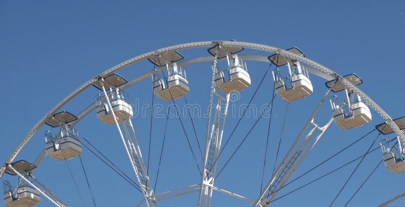 White Ferris Wheel with Empty Gondolas and Blue Sky Stock Image - Image ...