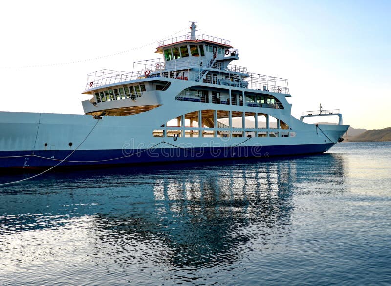 White Ferry Boat is in the Harbor with a Reflection in the Sea Stock ...