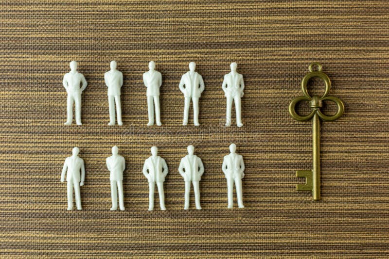 White Figure Miniature on Orange Pastel for Business Content Stock ...