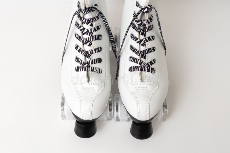 White Figure Roller Skates with Striped Laces on White Background Stock ...