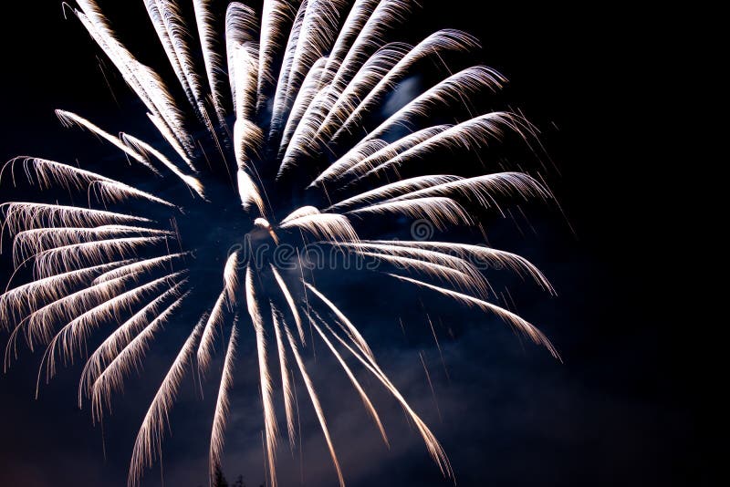 White Fireworks Bursting High in the Sky Stock Photo - Image of summer ...