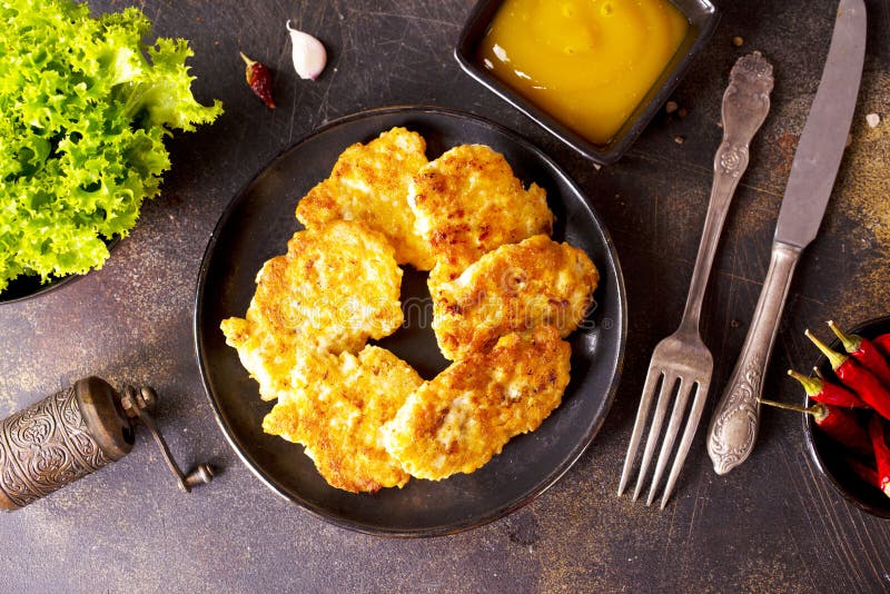 White Fish Cutlets on Black Plate Stock Image - Image of food, cutlet ...