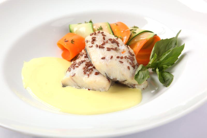 White Fish on a Plate with Sauce Stock Photo - Image of closeup, baked ...