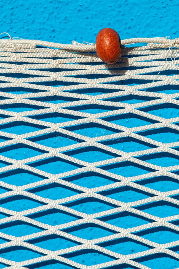 A White Fisher Net Hanging on a Blue Wall Stock Image - Image of design ...