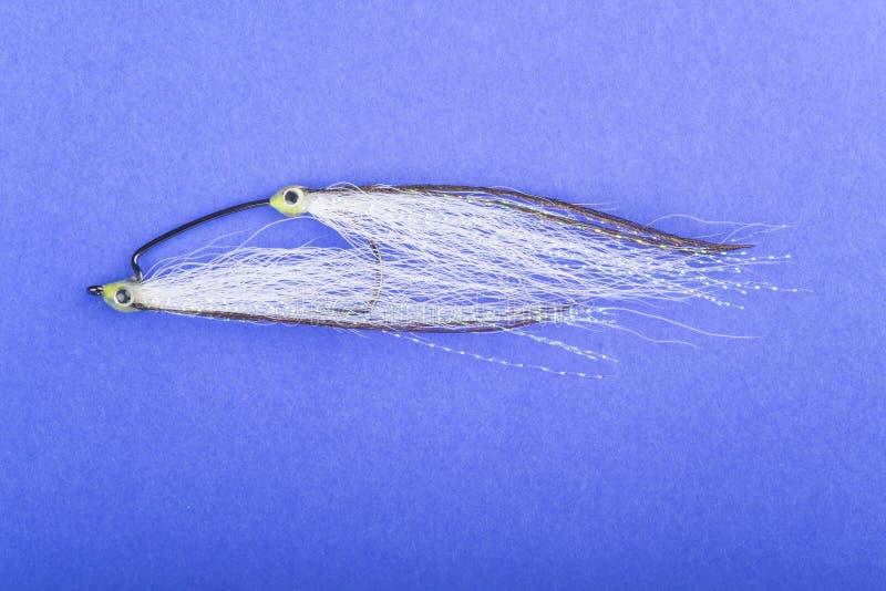White Fishing Fly on Purple 2 Stock Photo - Image of handmade, hand ...