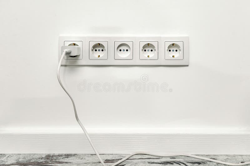 White Five-way Wall Power Socket on White Wall Stock Photo - Image of ...