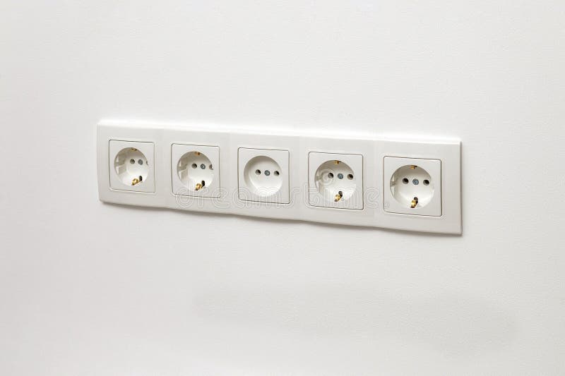 White Five-way Wall Power Socket on White Wall Stock Image - Image of ...
