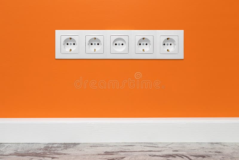 White Five-way Wall Power Socket on Orange Wall Stock Image - Image of ...