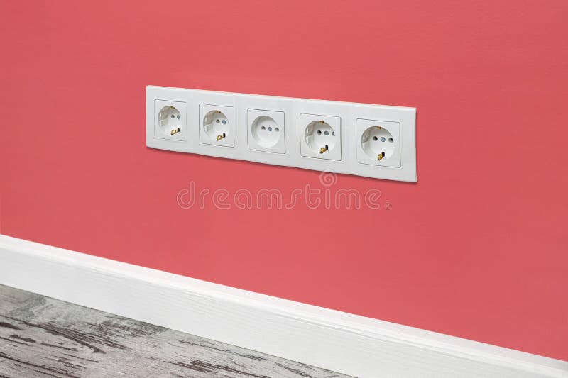 White Five-way Wall Power Socket on the Pink Wall Stock Photo - Image ...