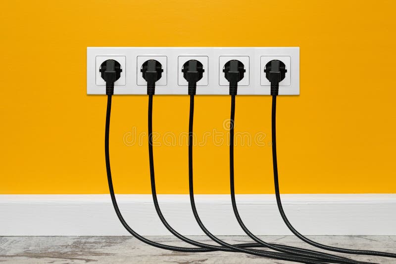 White Five-way Wall Power Socket on Yellow Wall Stock Photo - Image of ...