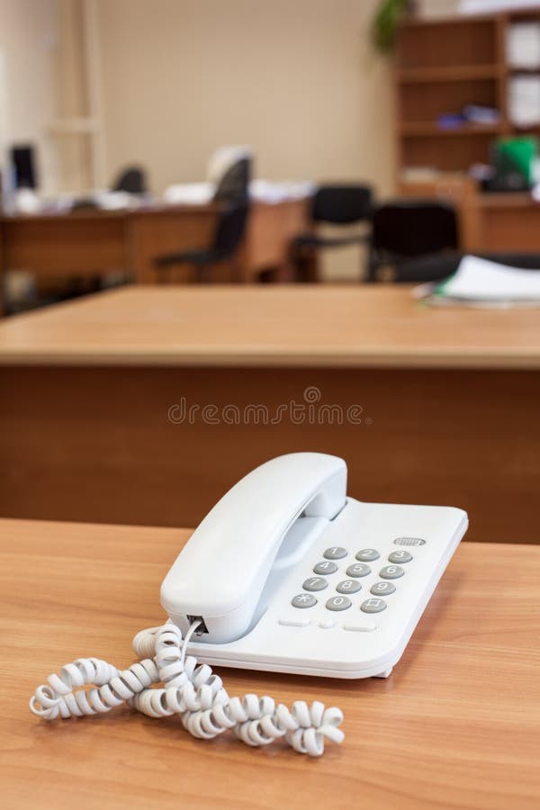White Fixed Network Telephone Stands on Office Desk, Empty Room Stock ...