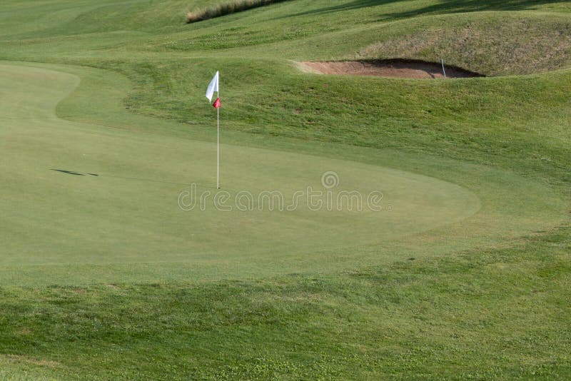 White Flagstick in Green Golf Course in Sunny Day Stock Image - Image ...