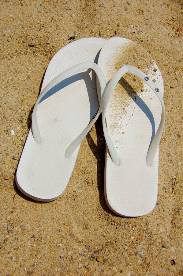 White Flip Flops in the Sand Stock Image - Image of sand, flipflop ...
