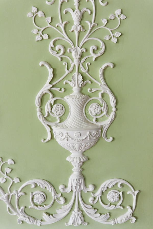 White Floral Plaster Bas-relief on the Green Wall. Classic Decorative ...