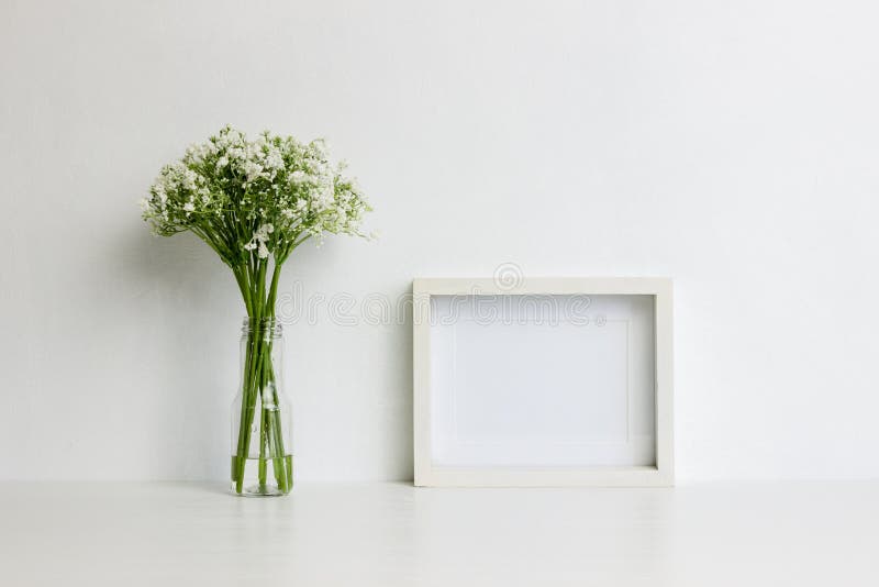 White Flowers with White Frame Over the White Wall. Stock Photo - Image ...