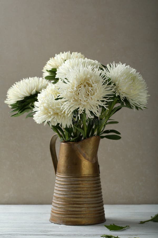 White Flowers in Rustic Pitcher Stock Image - Image of interior ...