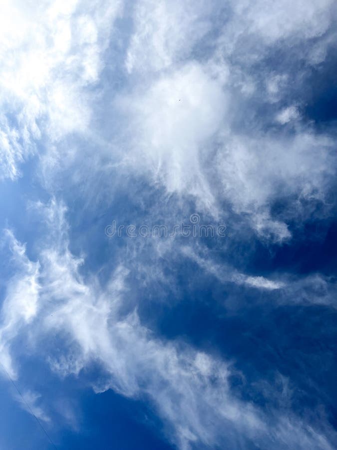 White Fluffy Clouds in the Blue Sky Stock Photo - Image of sunlight ...