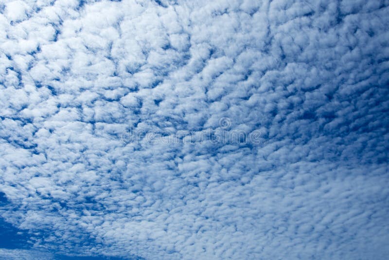White Fluffy Clouds in the Bright Blue Sky with Light from the S Stock ...