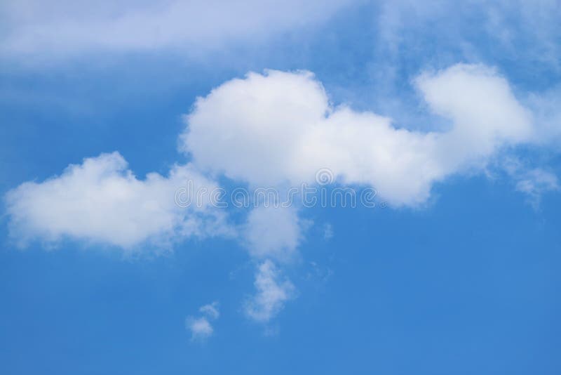 White Fluffy Clouds Floating on Bright Blue Sky Stock Photo - Image of ...