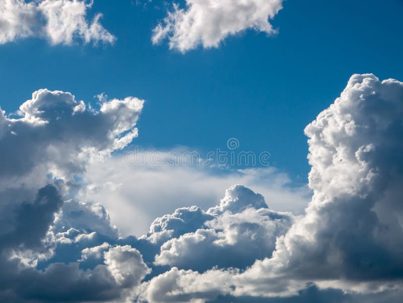 White Fluffy Epic Clouds on Blue Sky Stock Photo - Image of rain ...