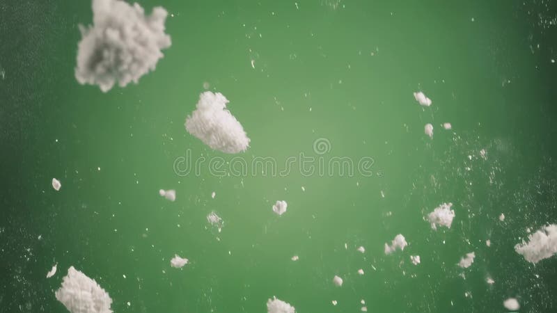 White Fluffy Particles Floating on Green Screen Background Stock Video ...