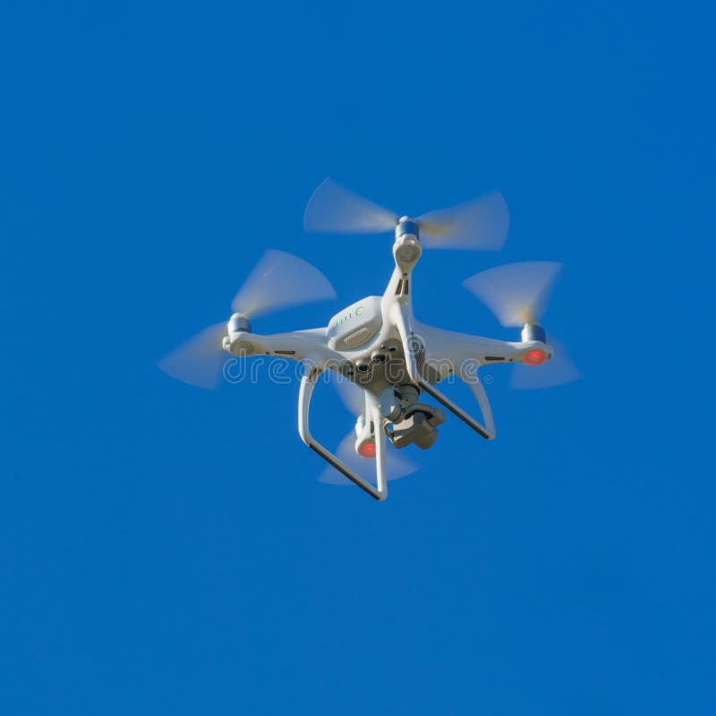 White Flying Copter Against the Sky Stock Photo - Image of unmanned ...
