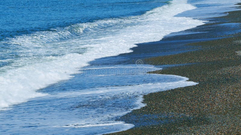 White Foam Wave Beaching on Sea Shore Pebble. Pebble Beach Foam Sea ...
