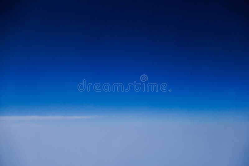 White Fog Under a Very Deep Blue Sky during a Flight into the Vacation ...