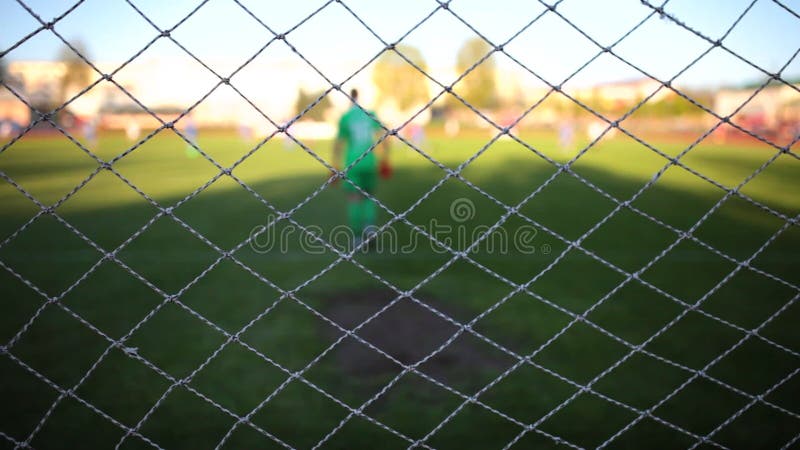 Focus on Net, Goalkeeper Stands at Goal during Soccer Match at Night ...