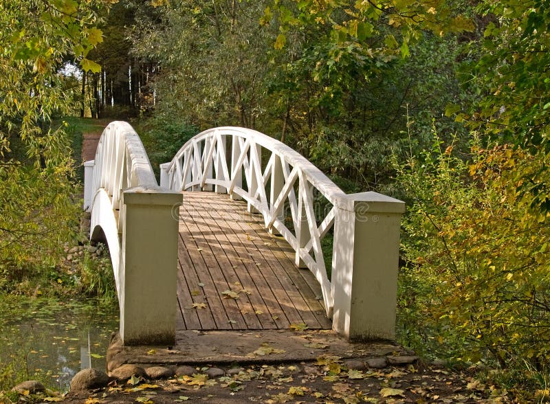 White footbridge in park stock image. Image of green - 11573659