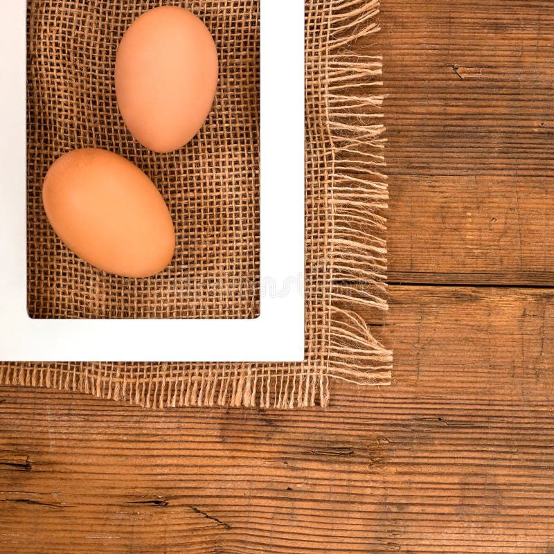 Frame with Egg Inside on Brown Wooden Background Texture Stock Image ...