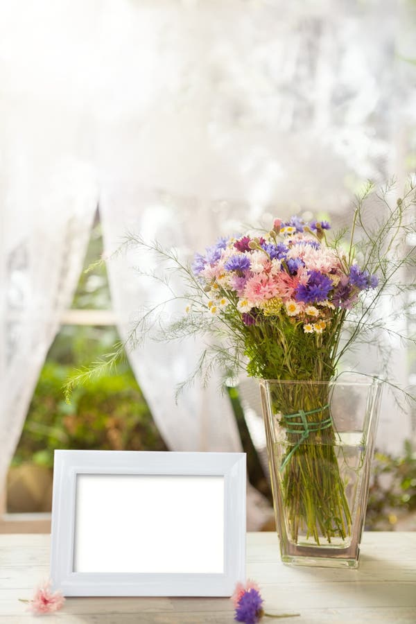 White Frame and Vase with Flowers Stock Photo - Image of elegant, daisy ...