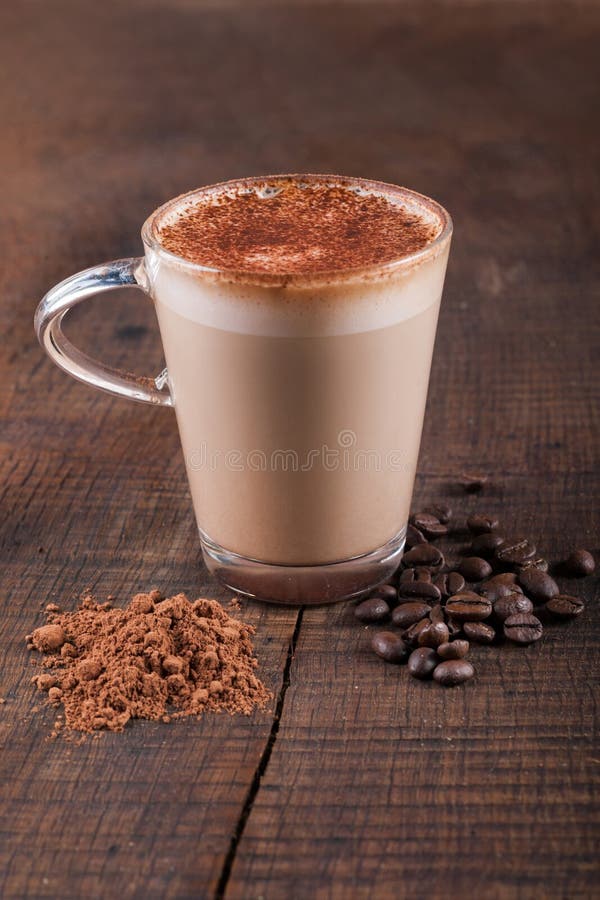 White Frappe Coffee Glass with Iced Drink on a Dark Wooden Table in a ...