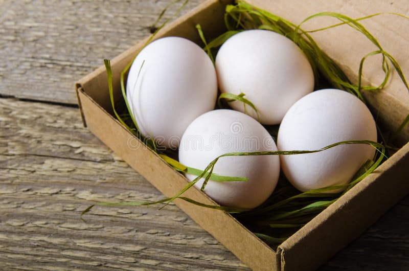 White Fresh Eggs in Cardboard Box with Grass Stock Photo - Image of ...