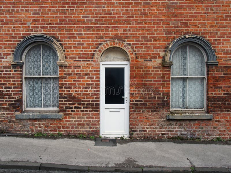 Red Front Door and Windows of a Typical Old Brick British Terraced ...