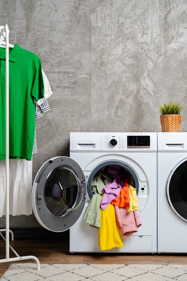 Open Front Loading Washing Machine with Colourful Clothes Stock Image ...
