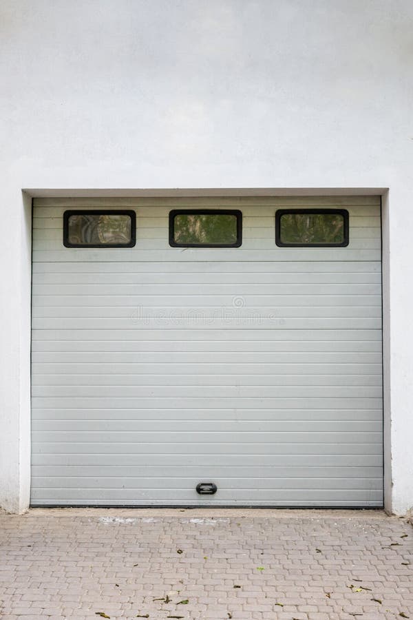 White Garage Door. Automatic Gate with Three Windows Stock Photo ...