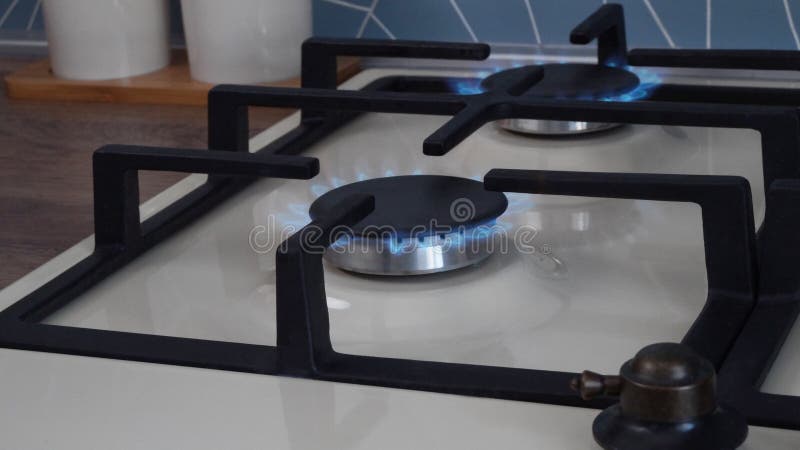 White Gas Cooktop with Turned on Burners in Kitchen Stock Photo - Image ...
