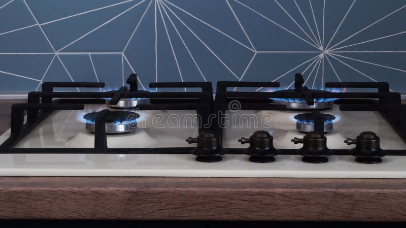 White Gas Cooktop with Turned on Burners in Kitchen Stock Photo - Image ...