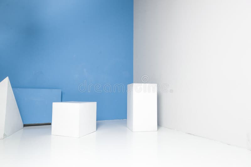 White Geometric Shapes in Room with Blue Wall Stock Photo - Image of ...