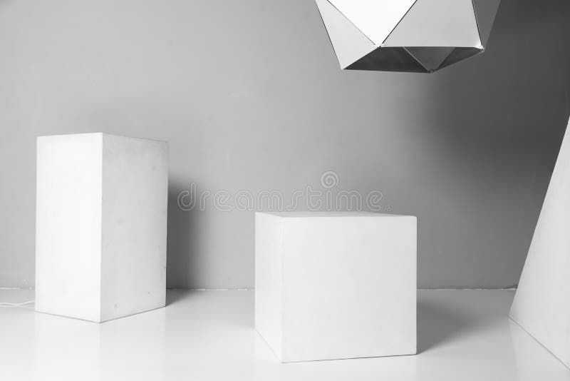 White Geometric Shapes in Room with Gray Wall Stock Photo - Image of ...