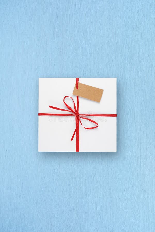 White Gift Box with Blank Tag on Table Stock Photo - Image of holiday ...