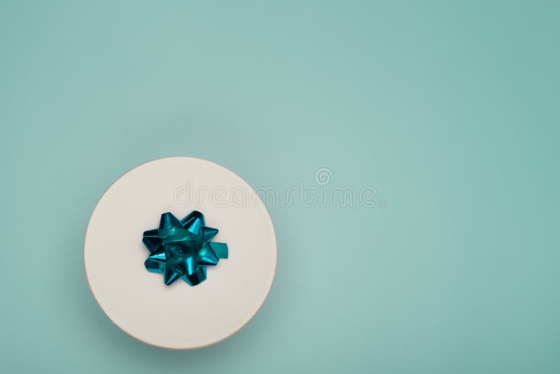 Gift box on blue or cyan stock image. Image of colorful - 202404821