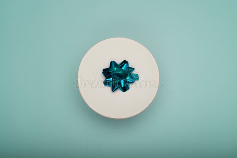 Gift box on blue or cyan stock image. Image of package - 202404713