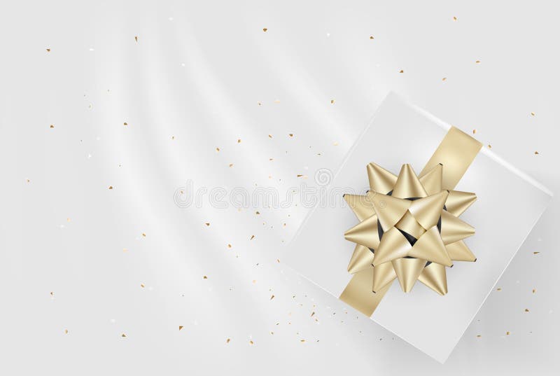 White Gift Box And Gold Bow Ribbons With Confetti On Light Silk Stock ...