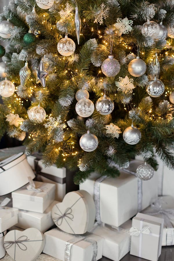 White Gift Boxes Under Christmas Tree Stock Photo - Image of blanket ...