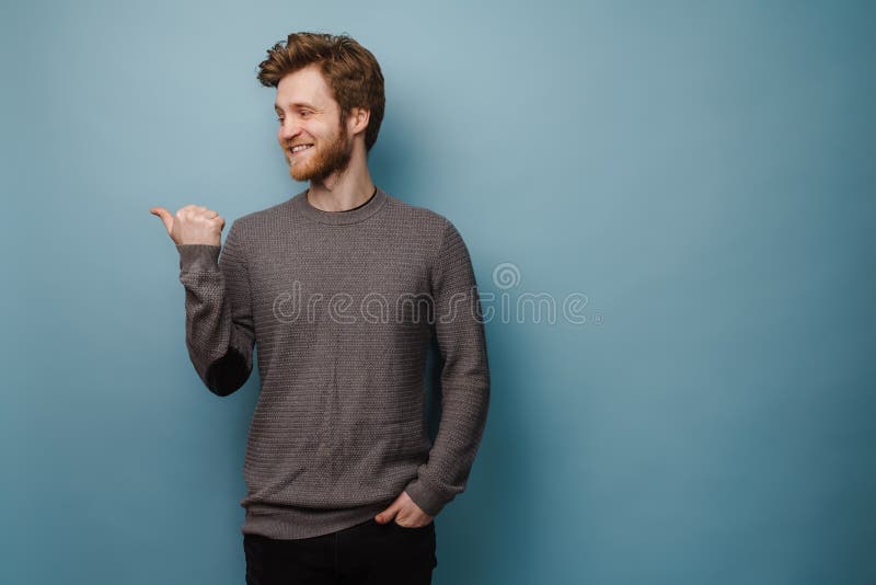 White Ginger Man Smiling while Pointing Finger Aside Stock Photo ...