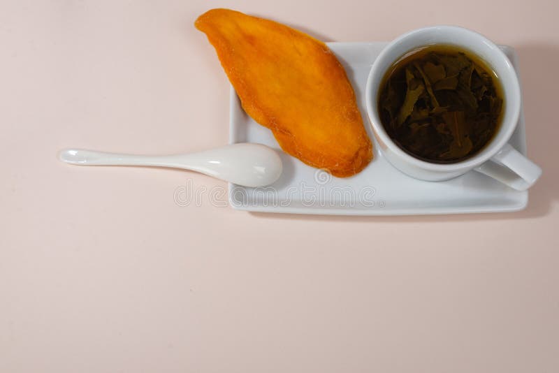 White Glass Cup of Fruit Tea with Mango Pieces . Exotic Ingredients ...