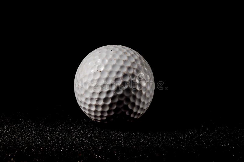 A White Golf Ball is Sitting on a Black Surface Stock Photo - Image of ...